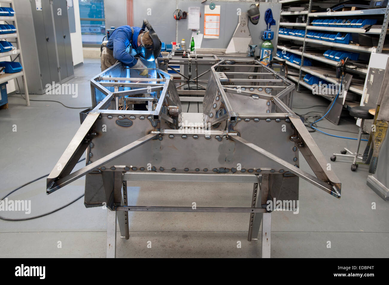 A worker welds a chassis at German sports car maker WeisMann Stock ...