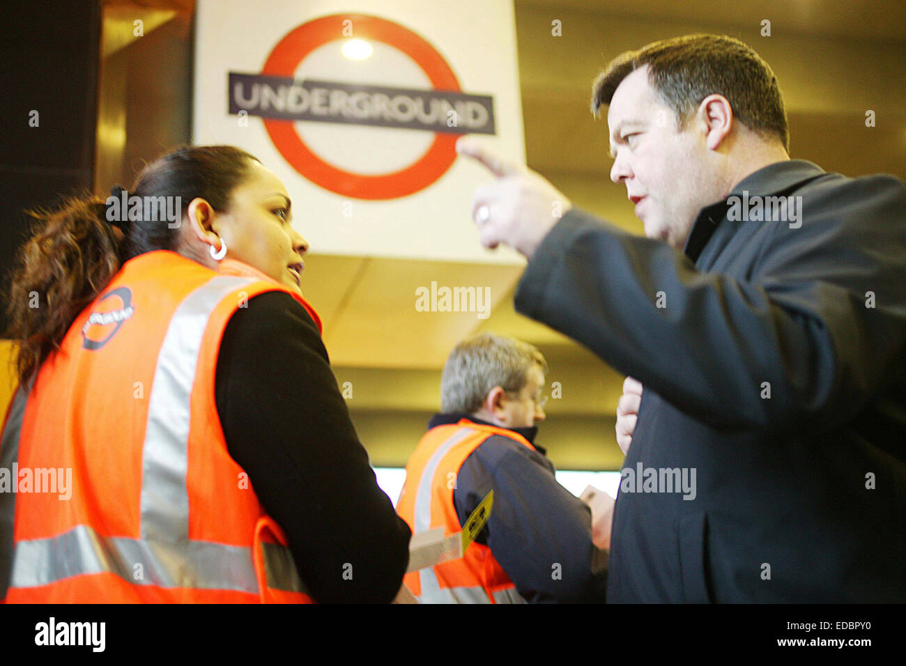 London underground staff help commuters hi-res stock photography and ...