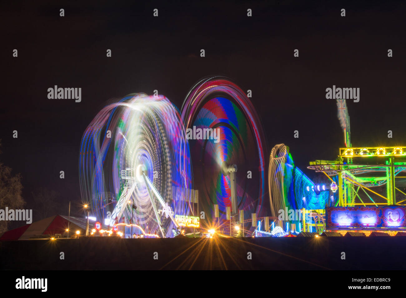 Fairground rides at Winter Wonderland, Hyde Park, London create a ...