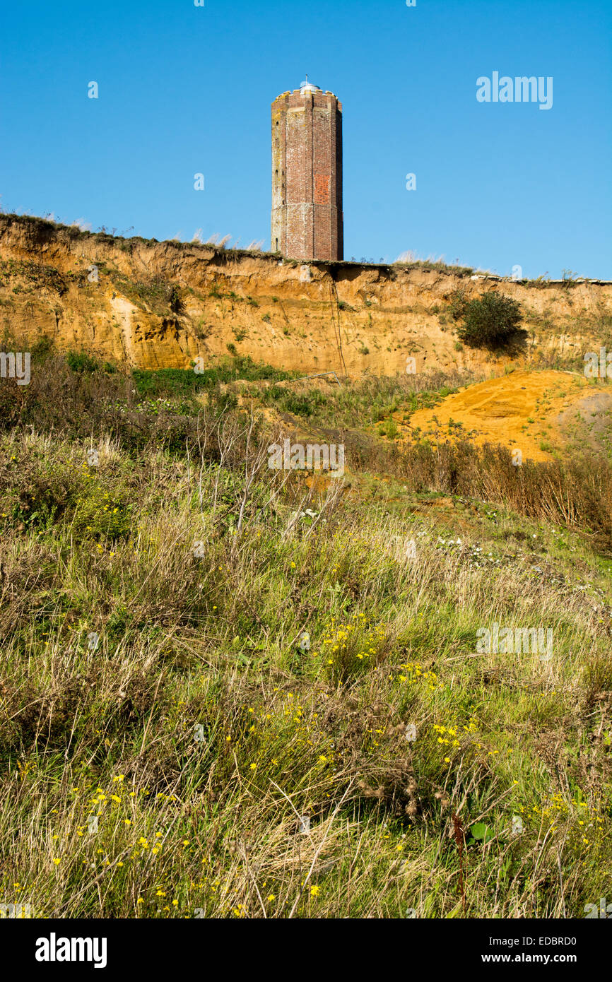 The tower at Walton-on-the-Naze stands above the eroding cliffs Stock ...