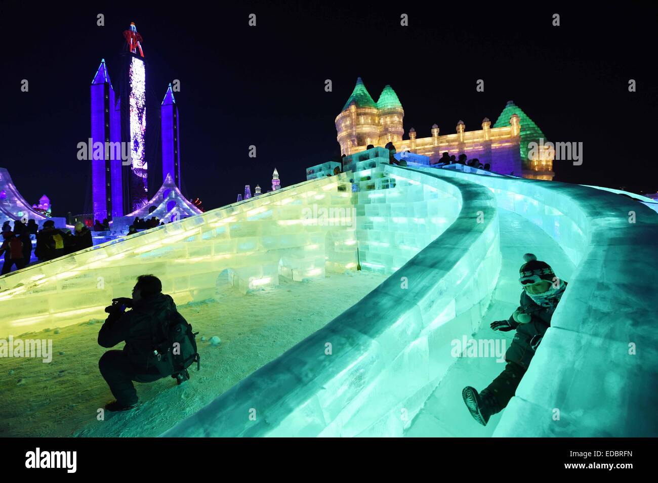 Harbin, China's Heilongjiang Province. 5th Jan, 2015. Tourists enjoy ...