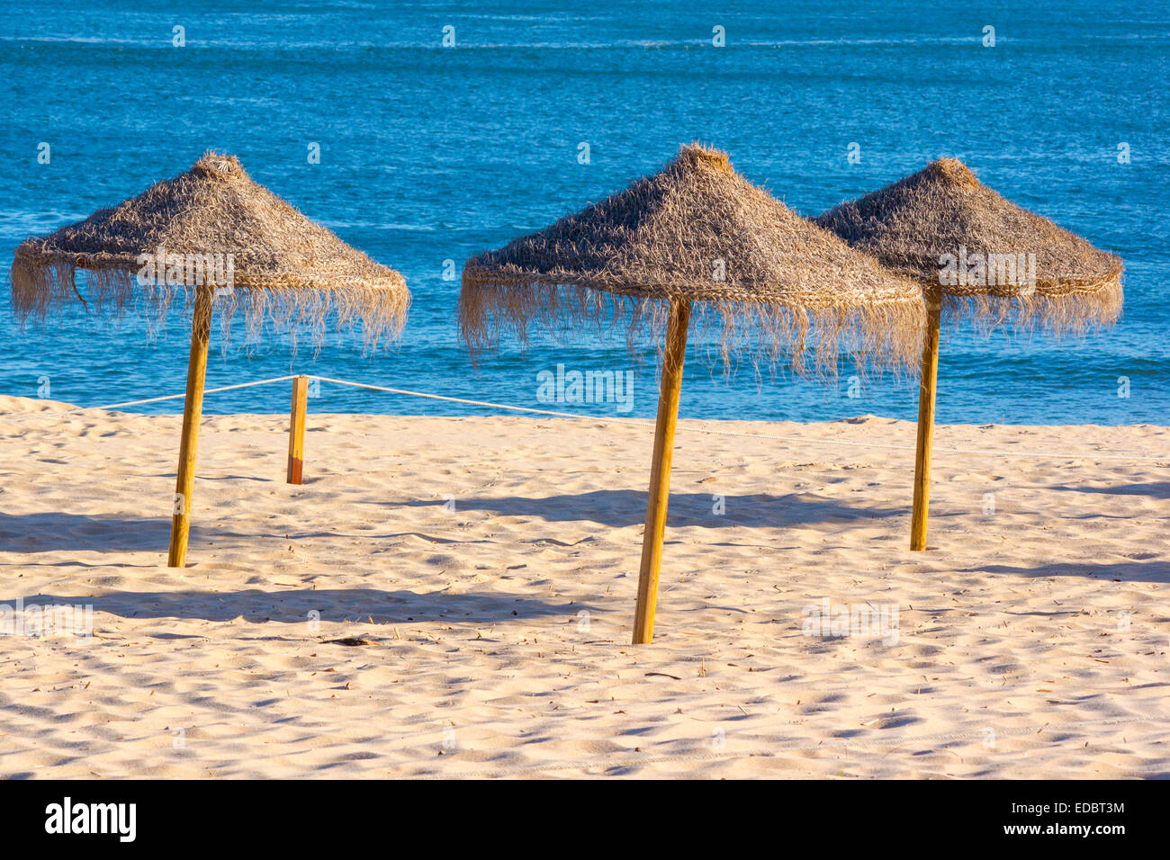 Blue sun parasols hi-res stock photography and images - Alamy