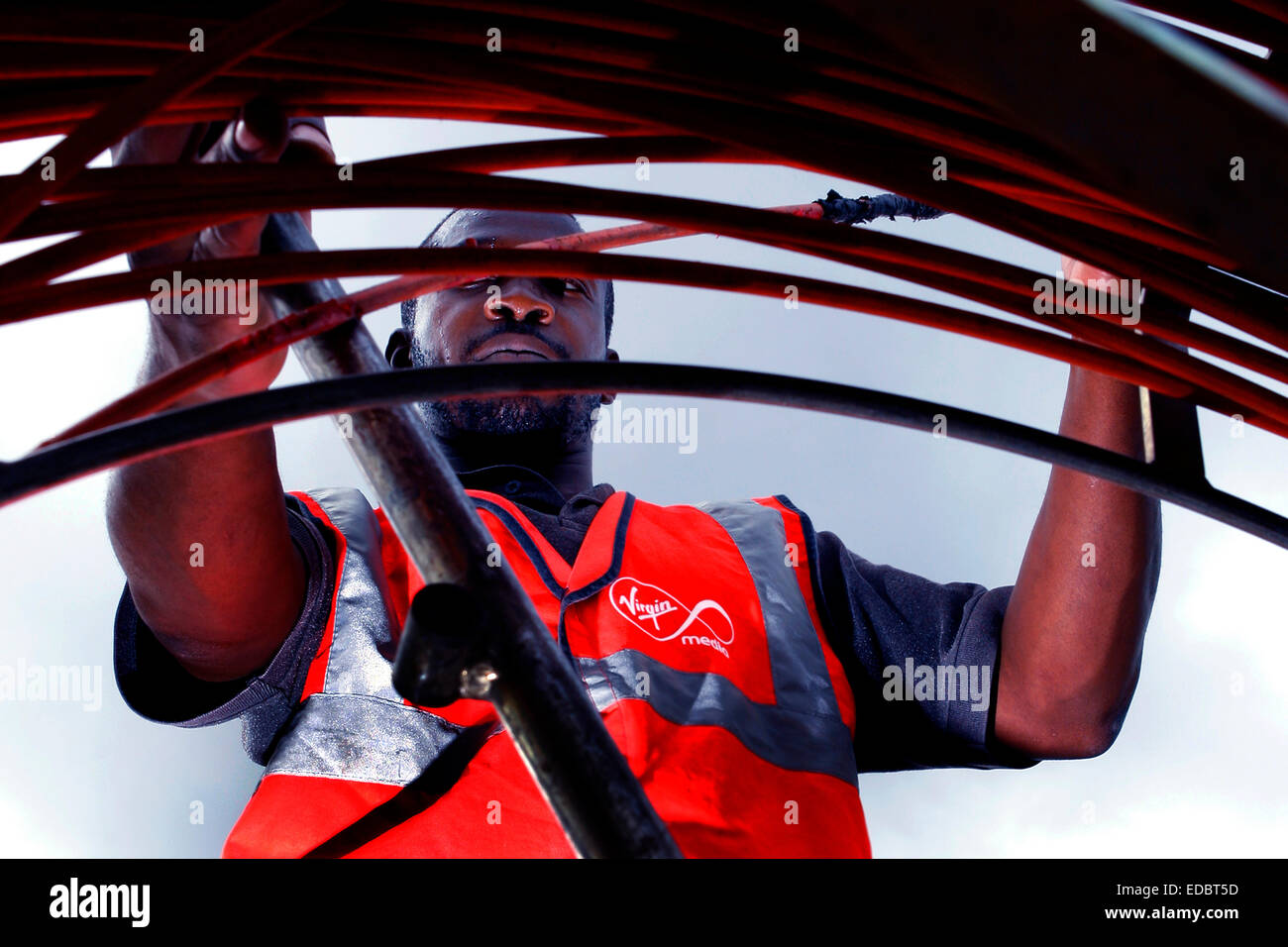 A Virgin Media engineer connecting a house to the Virgin telephone ...