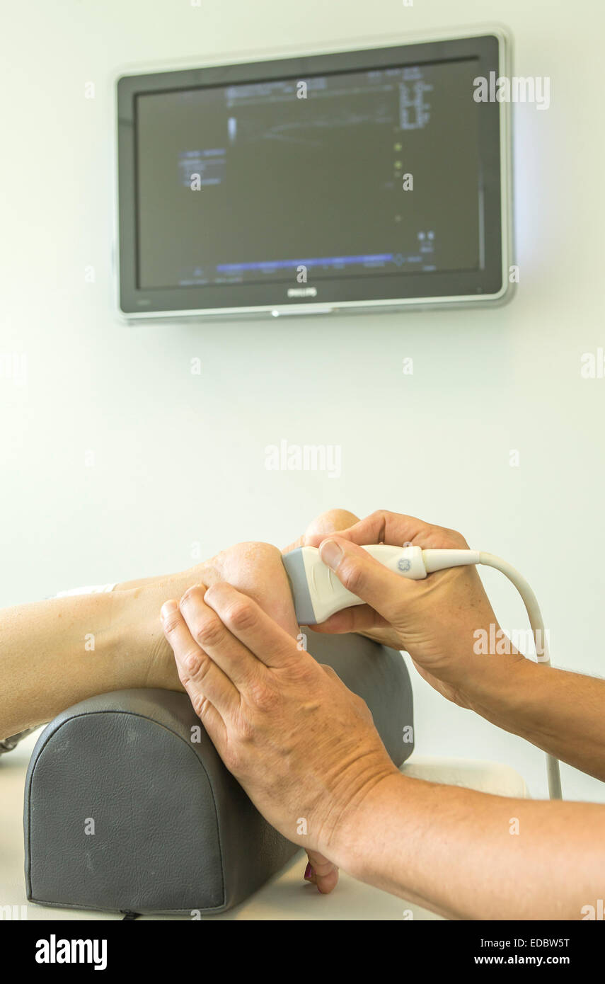 Foot echography on the heel with a screen in the background Stock Photo ...