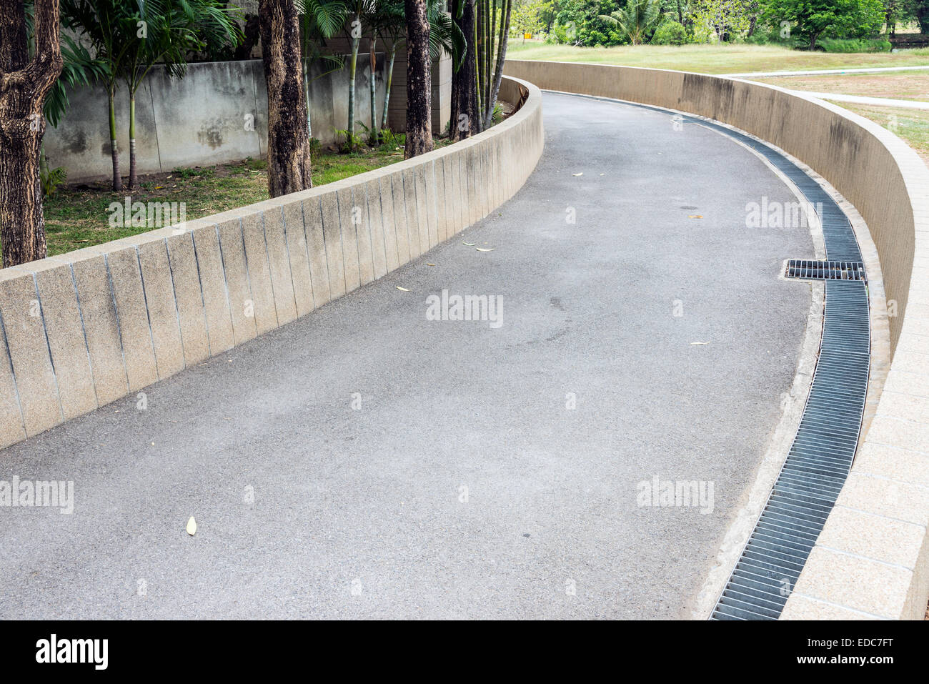 Curve street before to the tunnel in the park Stock Photo - Alamy