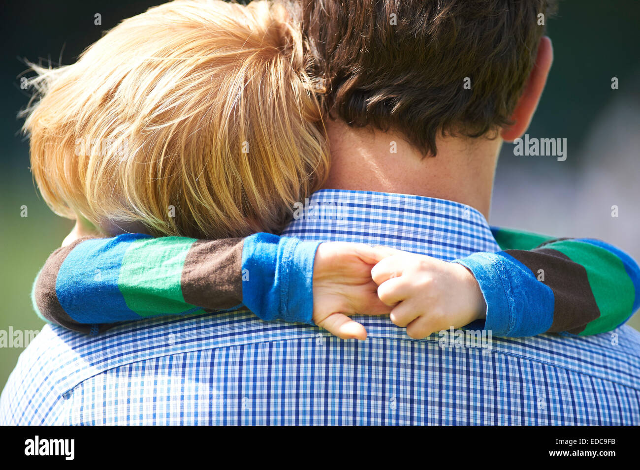 boy hugging father Stock Photo - Alamy