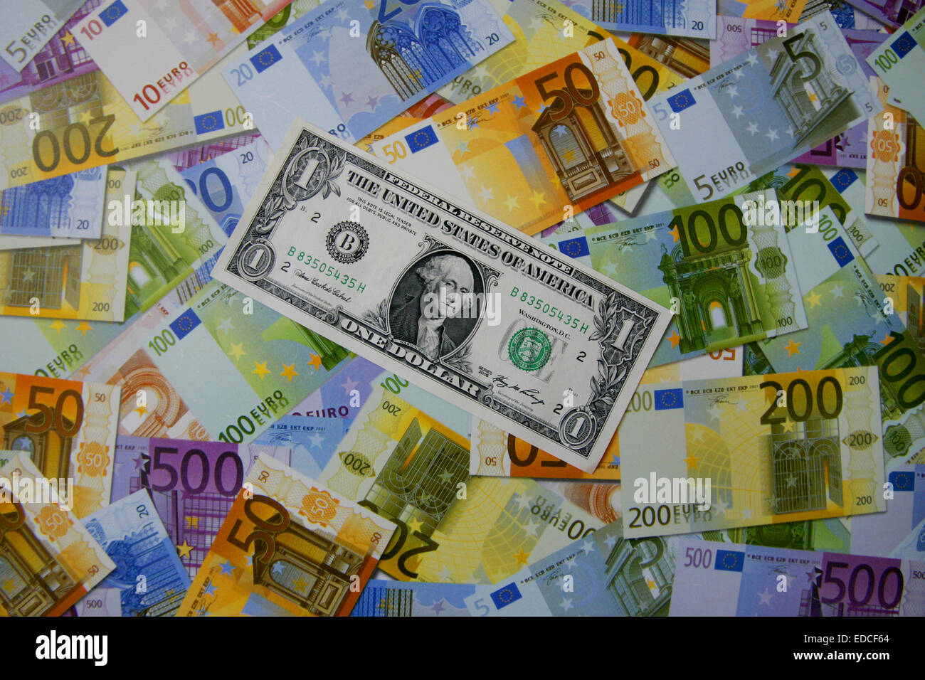 A Dollar note lies on top of a print depicting various Euro notes in ...