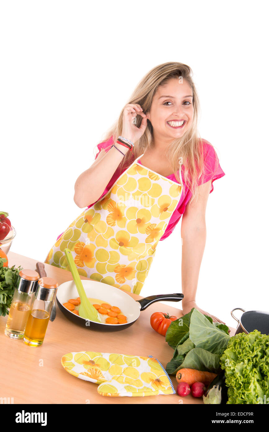 Beautiful woman cooking in the kitchen Stock Photo - Alamy