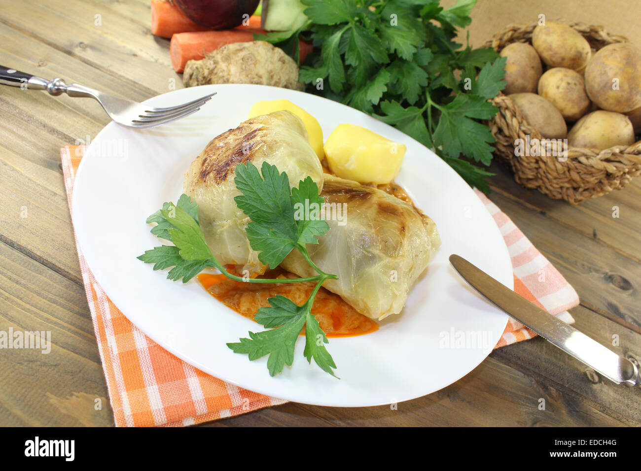 braised cabbage roulade with potatoes and sauce on a napkin Stock Photo ...