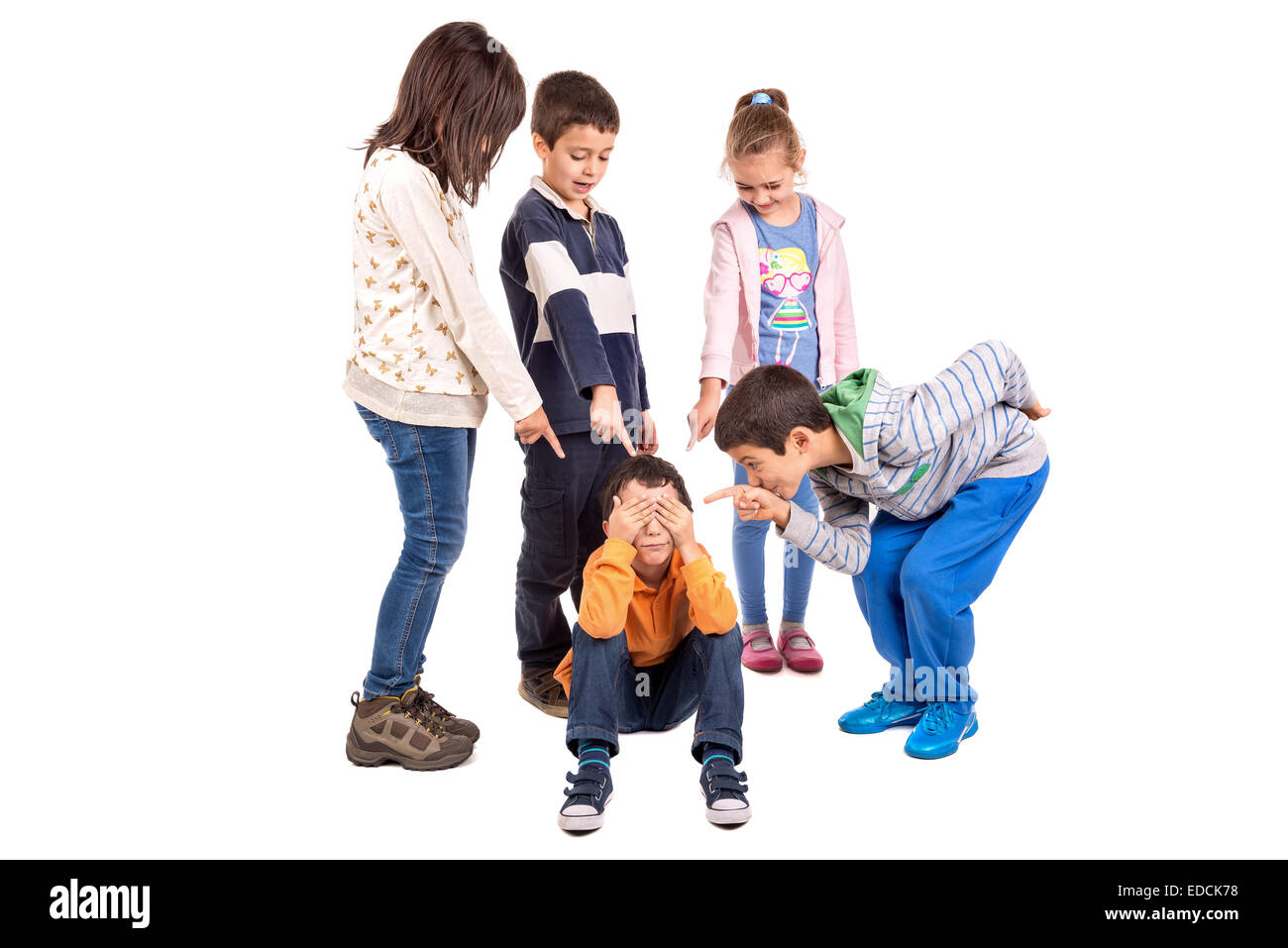 Group of children bullying an isolated child Stock Photo - Alamy