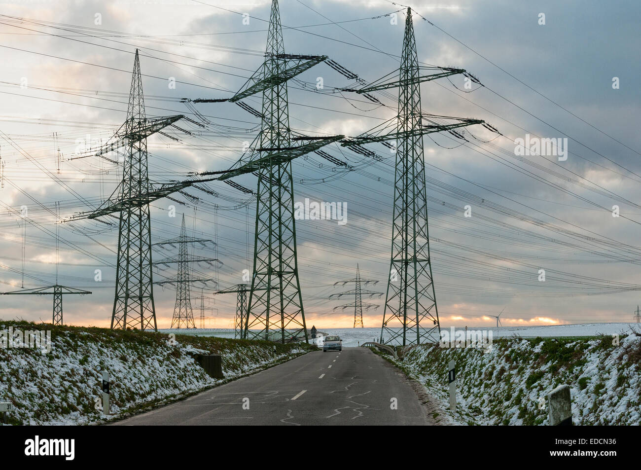 Electricity pylons in a barren, snowy landscape, Germany Stock Photo ...