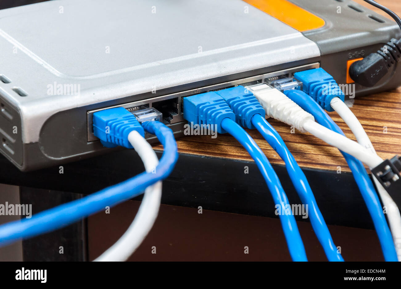 Variety of lan cable behind the modern router Stock Photo - Alamy