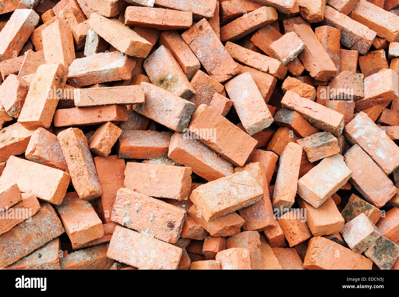 Brick stack on the ground for building Stock Photo - Alamy