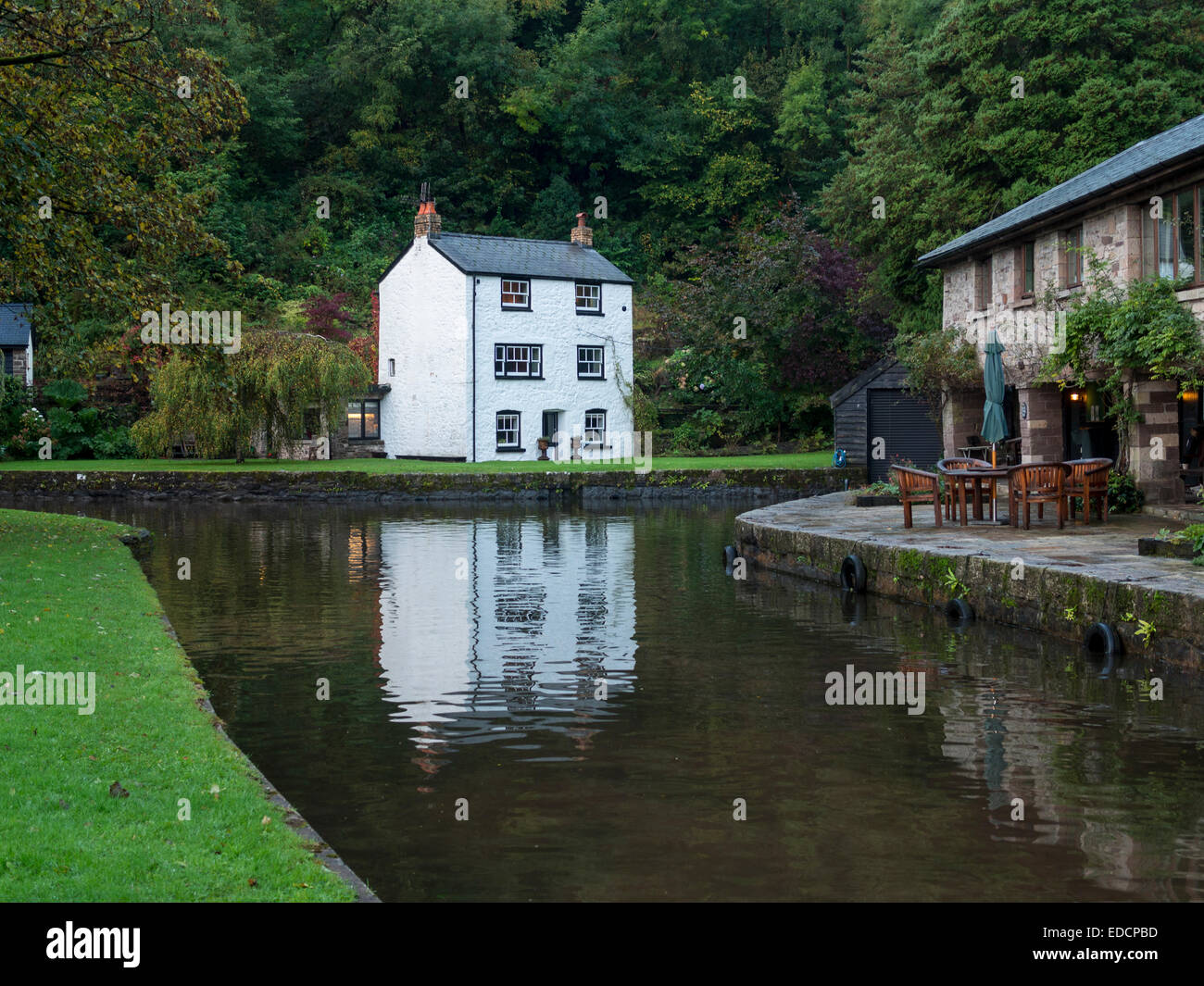 white painted house and reflection,on the Monmouthsire and Brecon Canal ...