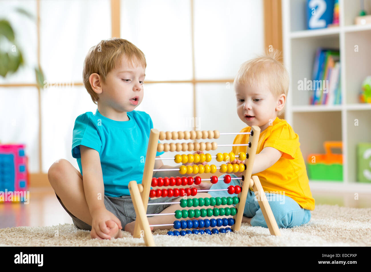 kids playing with abacus Stock Photo - Alamy