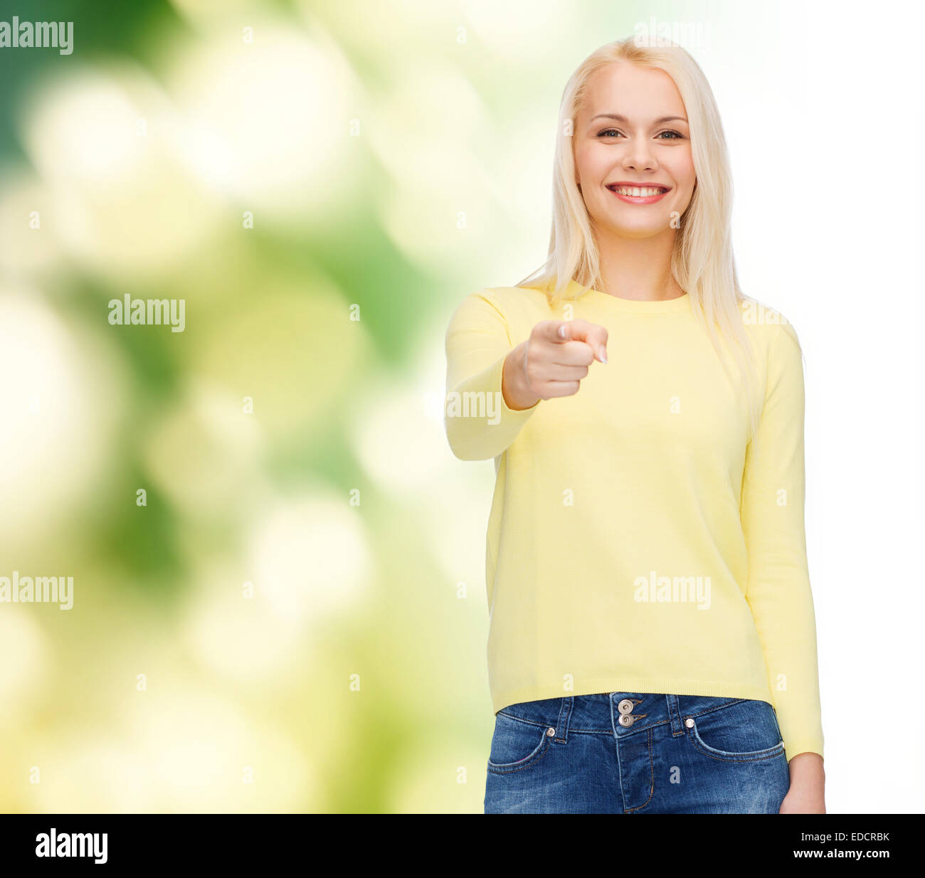 smiling woman pointing finger at you Stock Photo - Alamy