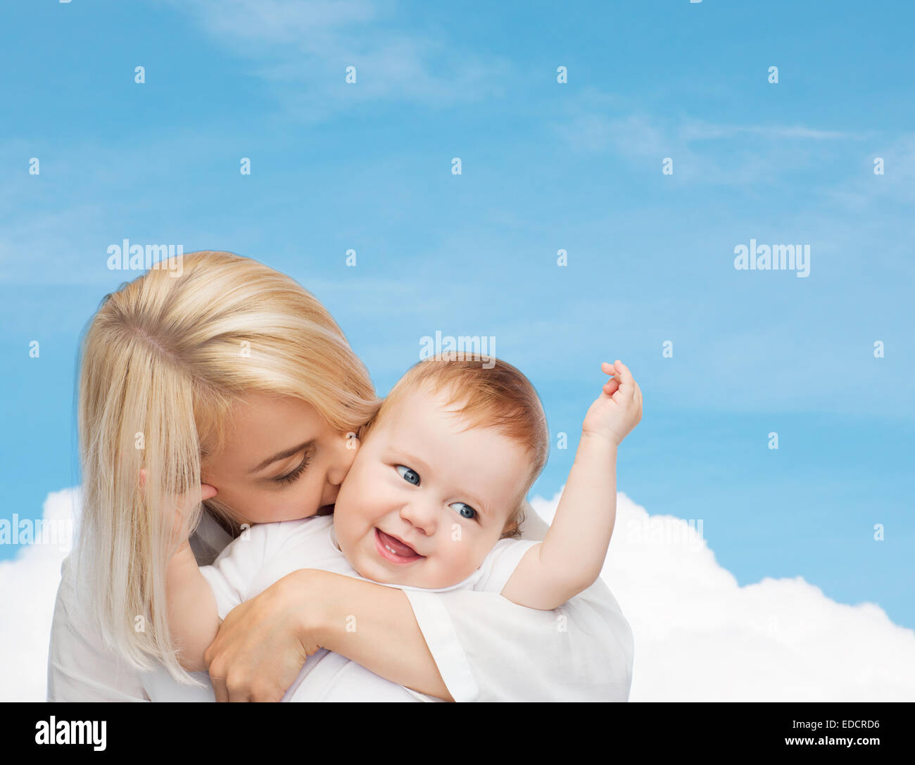 happy mother kissing smiling baby Stock Photo - Alamy