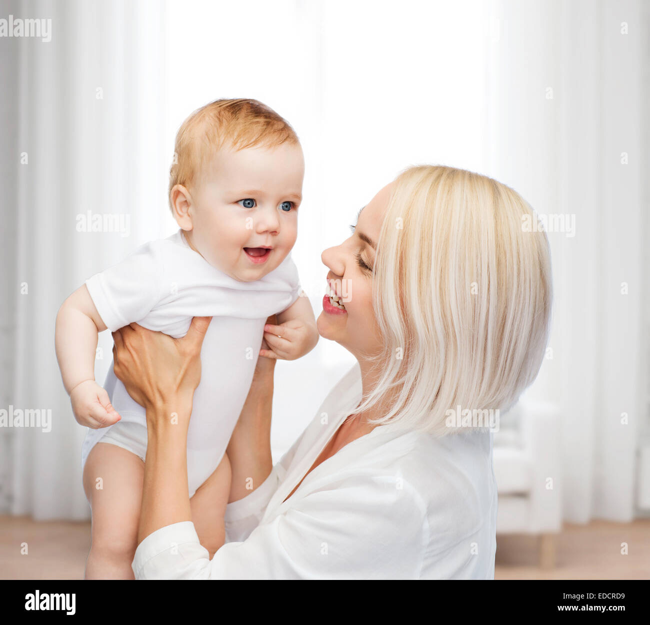 happy mother with smiling baby Stock Photo - Alamy