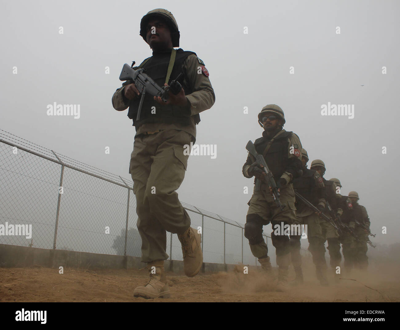Pakistani Security Force patrol along the Pakistan-India border area of ...