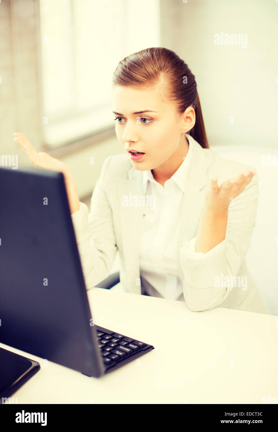 stressed student with computer in office Stock Photo - Alamy