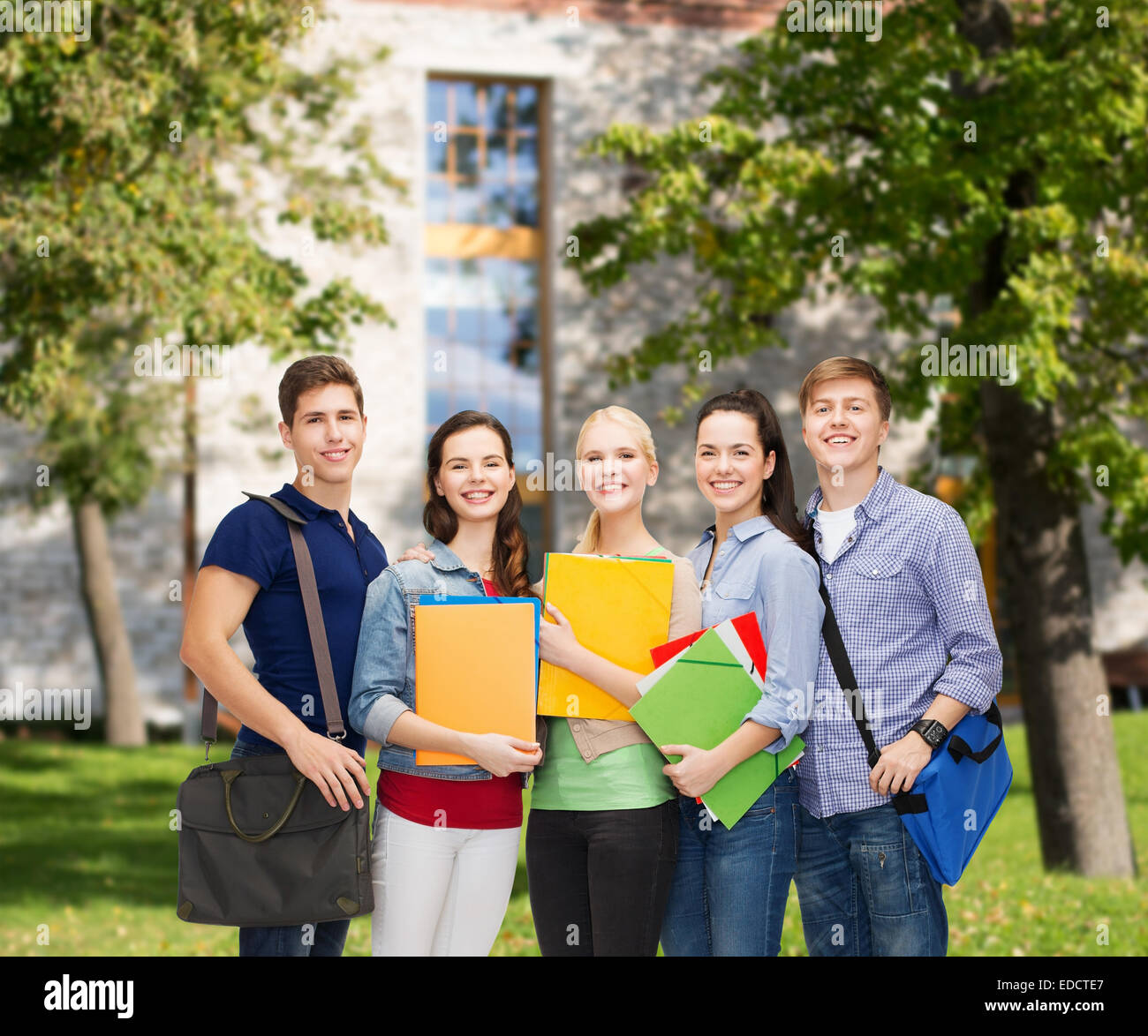 group of smiling students standing Stock Photo - Alamy