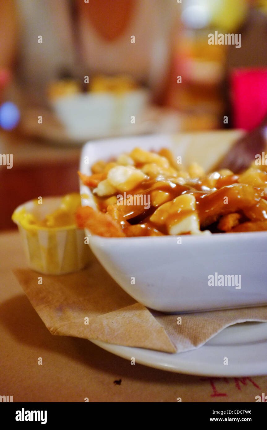 A poutine from Frite Alors in Montreal, Quebec Stock Photo - Alamy