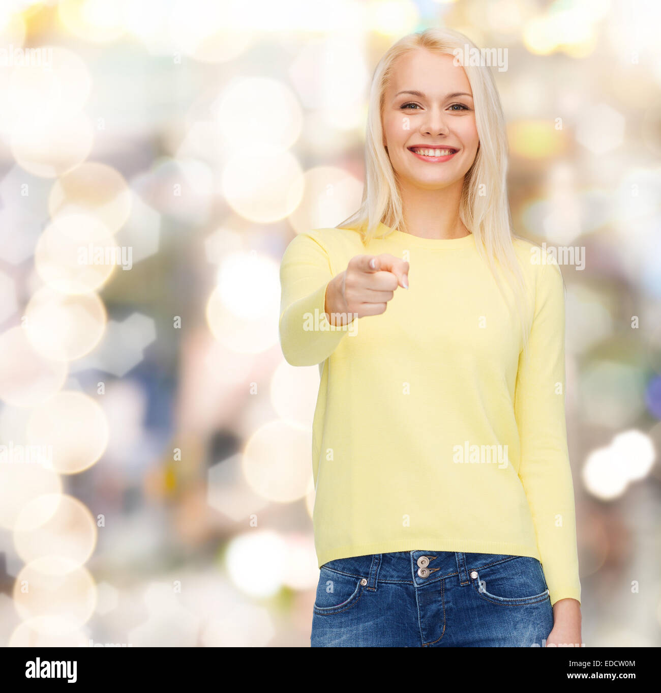 smiling woman pointing finger at you Stock Photo - Alamy