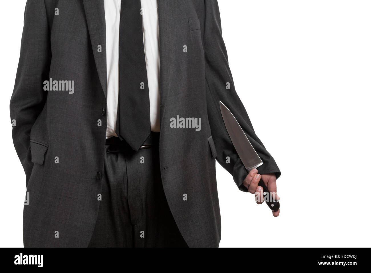 Man in suit holding a large knife in his hand isolated on white ...