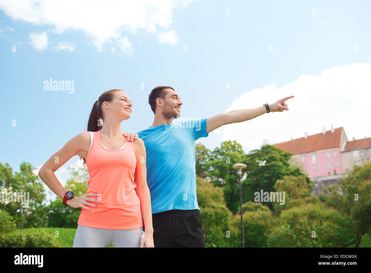 two smiling people outdoors Stock Photo - Alamy