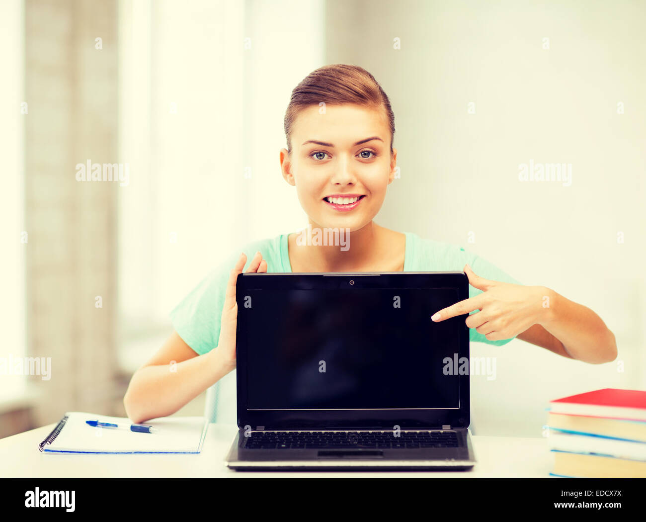 smiling student girl with laptop at school Stock Photo - Alamy