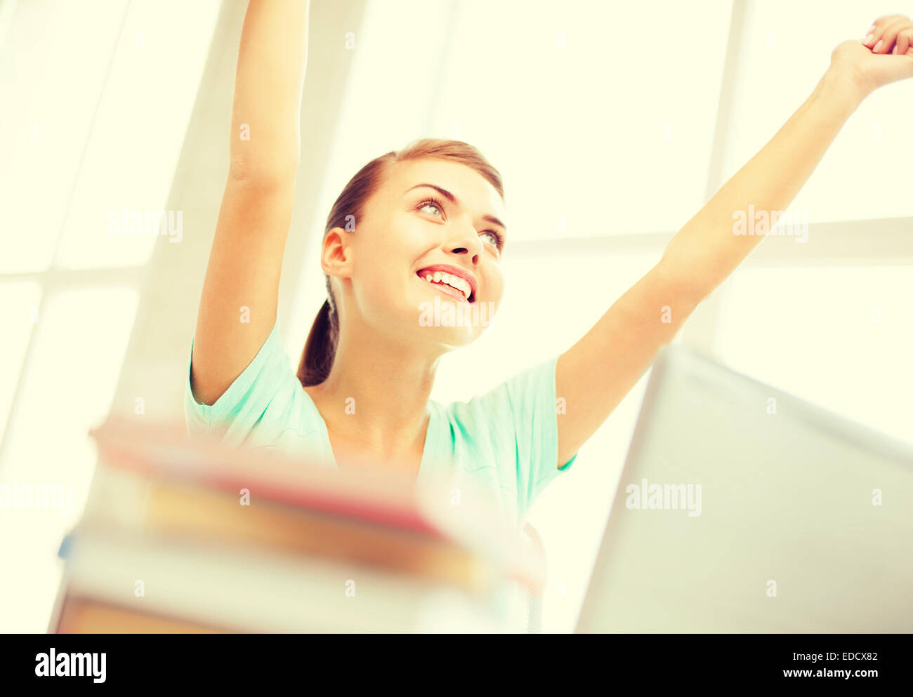 happy student girl with computer at school Stock Photo - Alamy