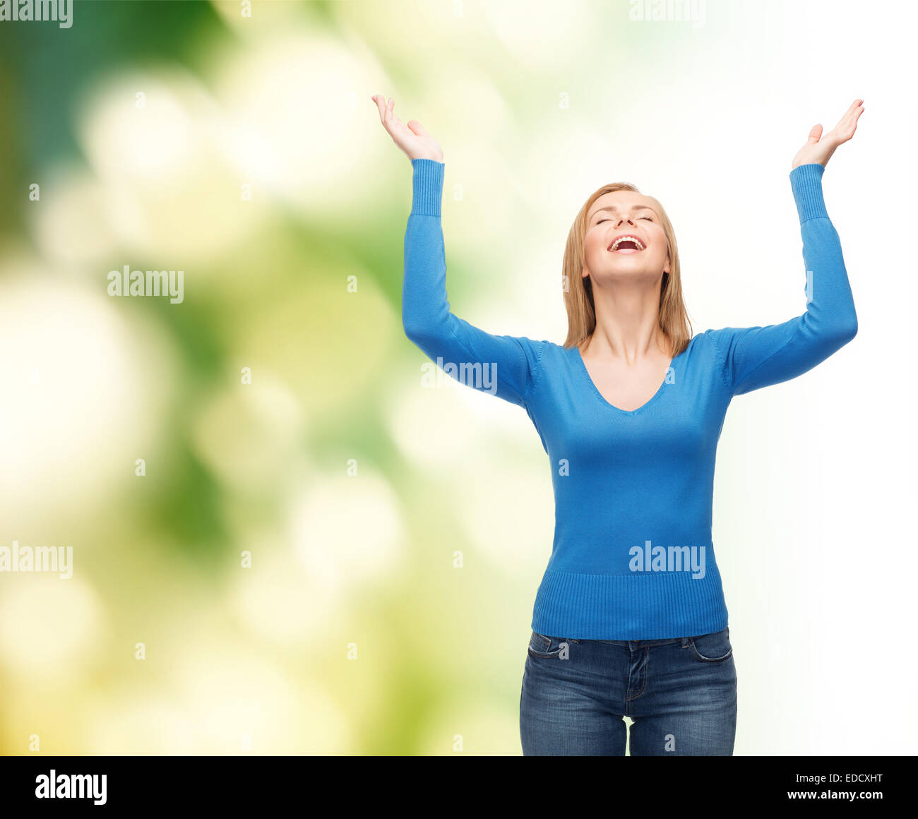 laughing young woman waving hands Stock Photo - Alamy