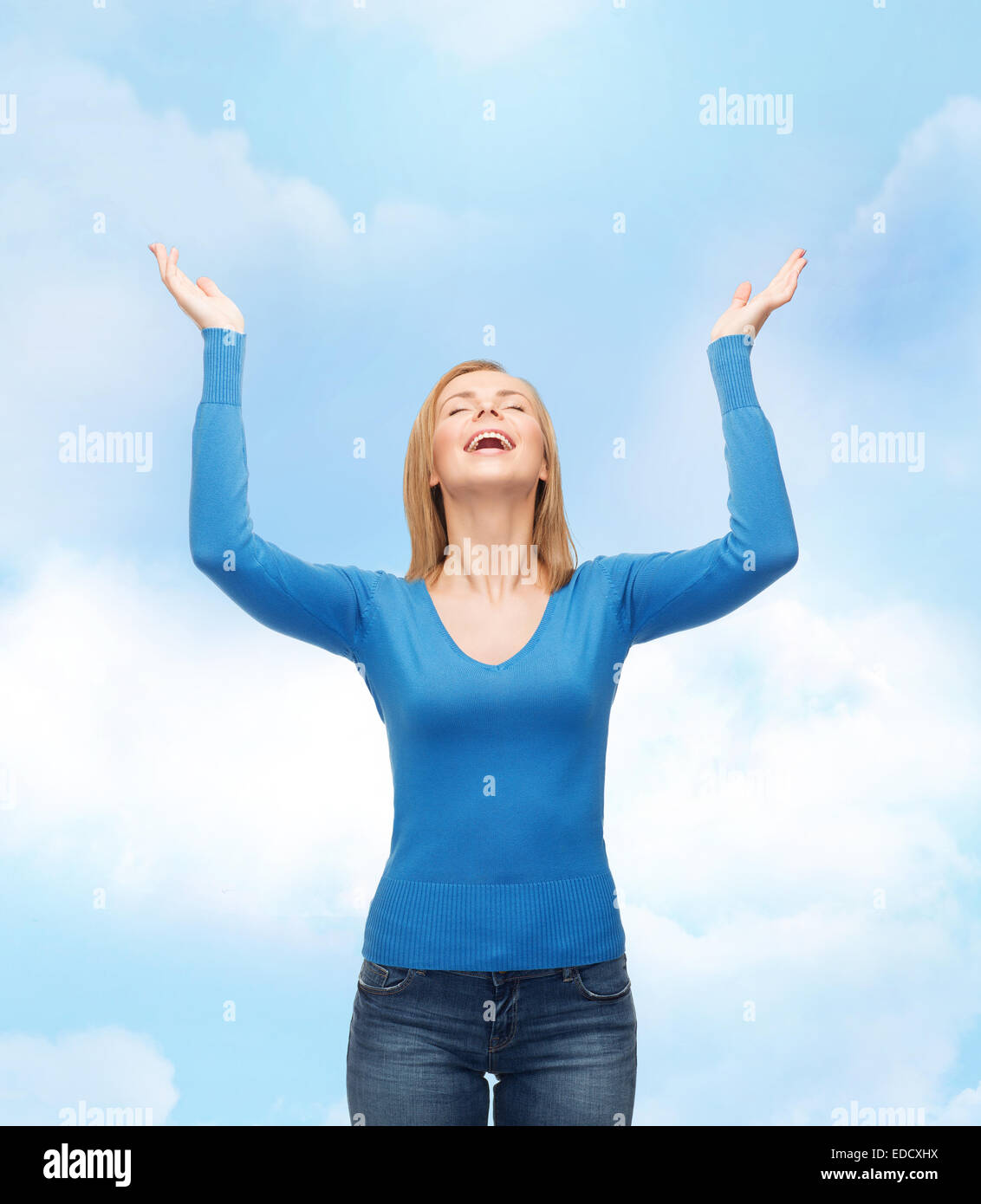 laughing young woman waving hands Stock Photo - Alamy