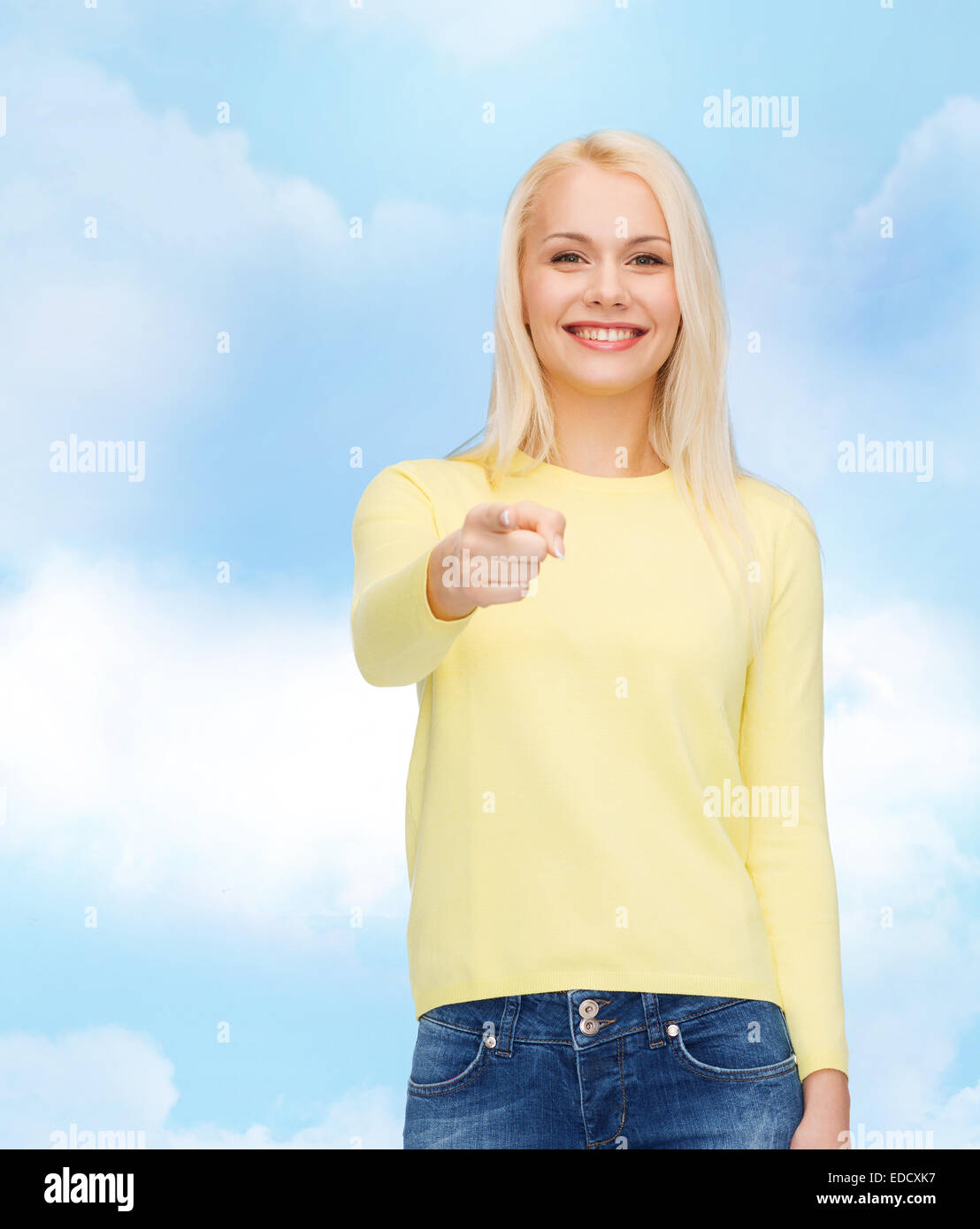 smiling woman pointing finger at you Stock Photo - Alamy