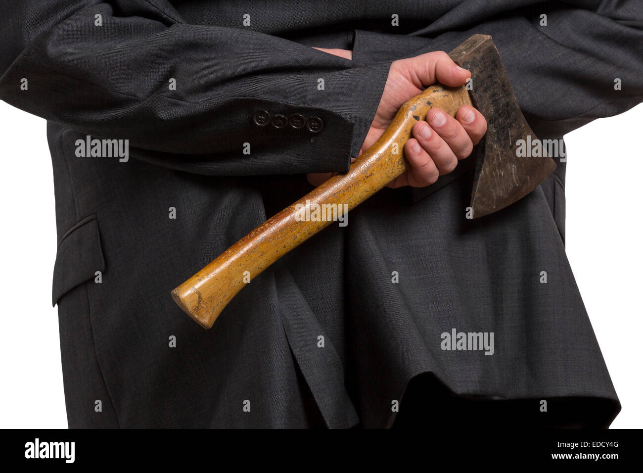 Man in suit hiding an axe behind his back isolated on white background ...