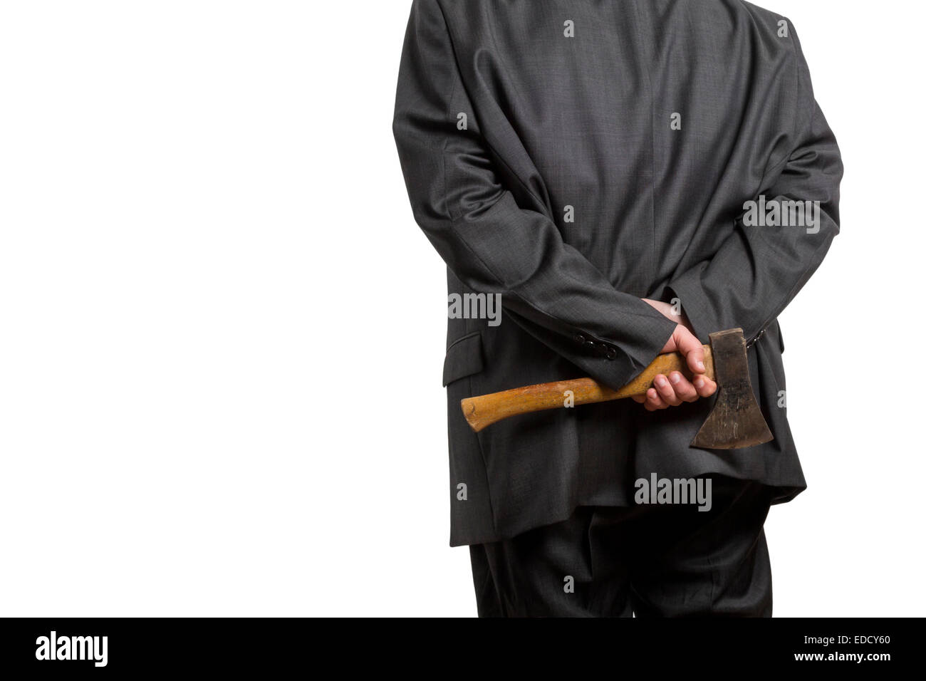 Man in suit hiding an axe behind his back isolated on white background ...