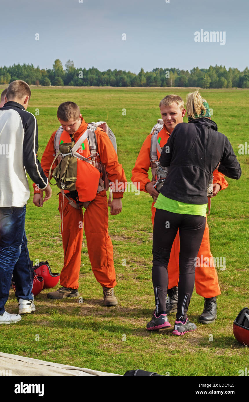 Parachutists - 2014. Check of parachutes before jumps Stock Photo - Alamy