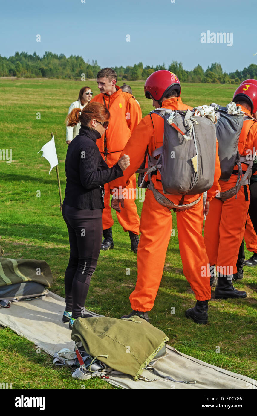 Parachutists - 2014. Check of parachutes before jumps Stock Photo - Alamy