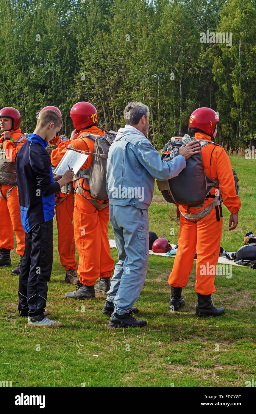 Parachutists - 2014. Check of parachutes before jumps Stock Photo - Alamy