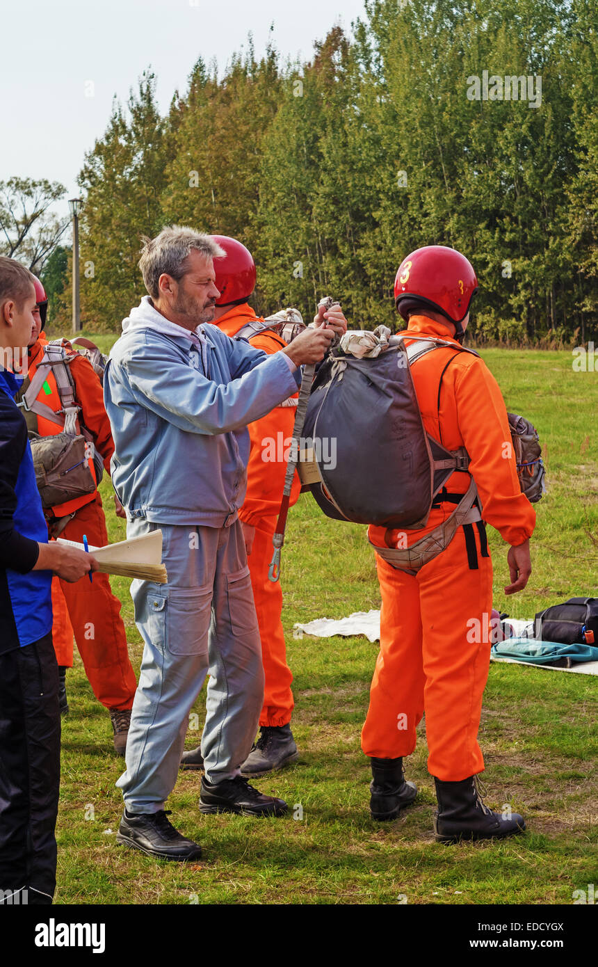 Parachutists - 2014. Check of parachutes before jumps Stock Photo - Alamy