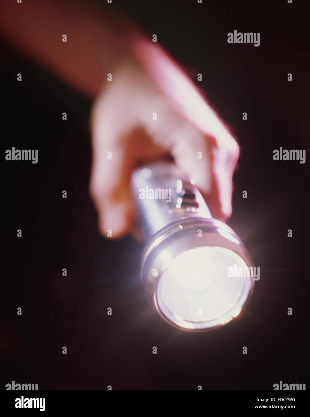 Flashlight in Hand Stock Photo - Alamy