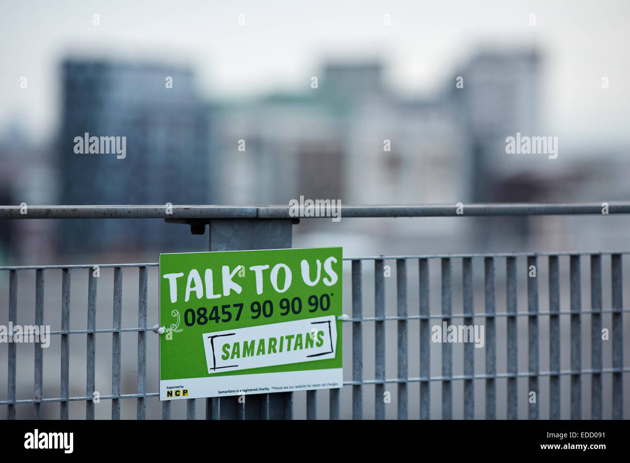 Talk to us Samaritans advert on the roof of a tall NCP owned building ...