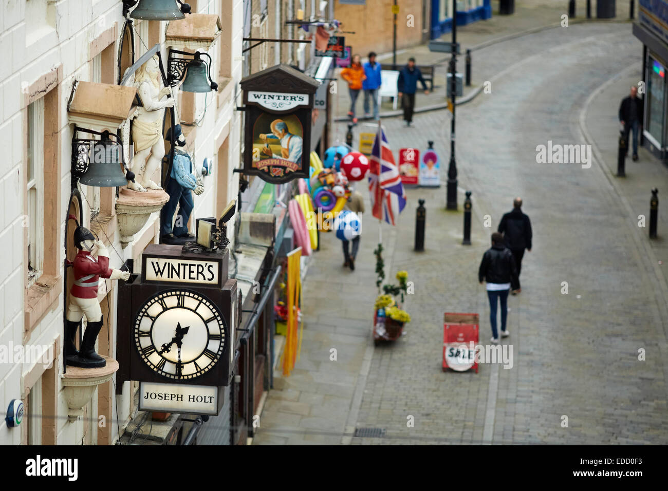 Stockport town centre Lower Hillgate, Winter's Pub clocks on the ...