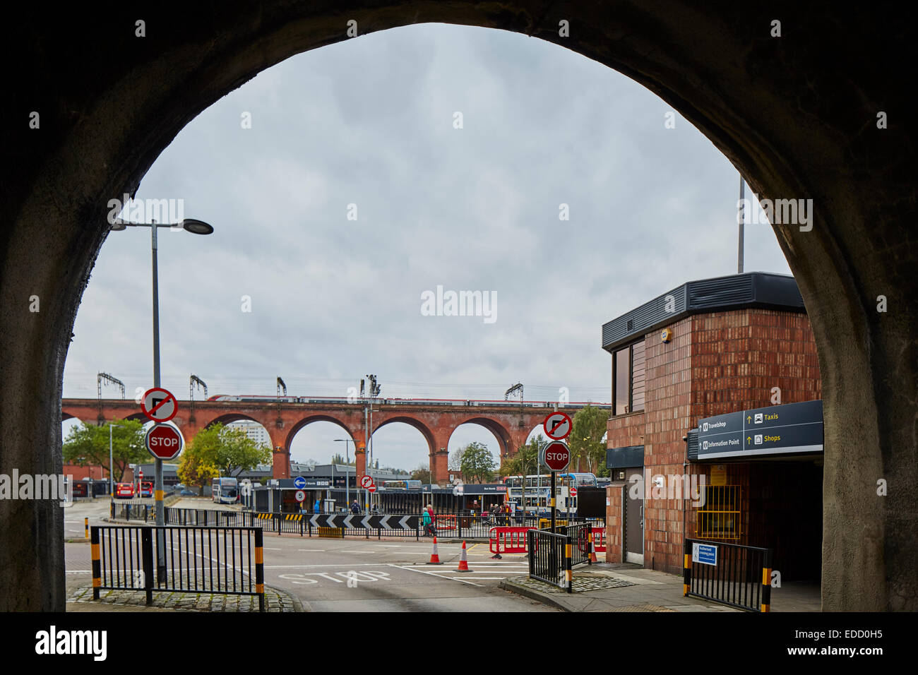 Stockport town centre's viaduct framed by an arch from the main A6 road ...