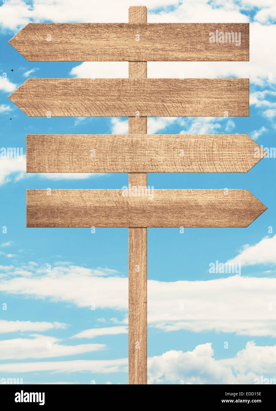 Blank brown wooden signpost against blue sky Stock Photo - Alamy