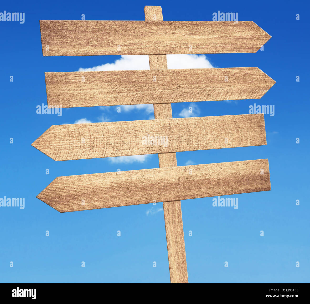 Blank brown wooden signpost against blue sky Stock Photo - Alamy