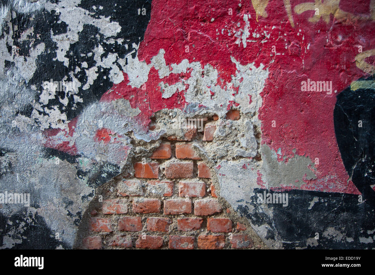 first floor of the brick wall with murals Stock Photo - Alamy