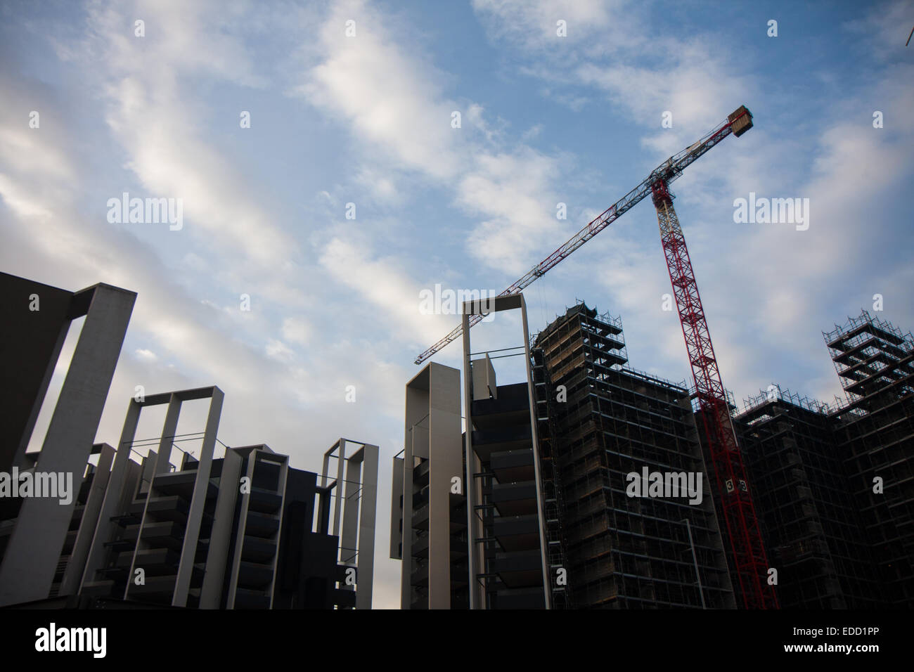 urban landscape with crane and skyscraper Stock Photo - Alamy