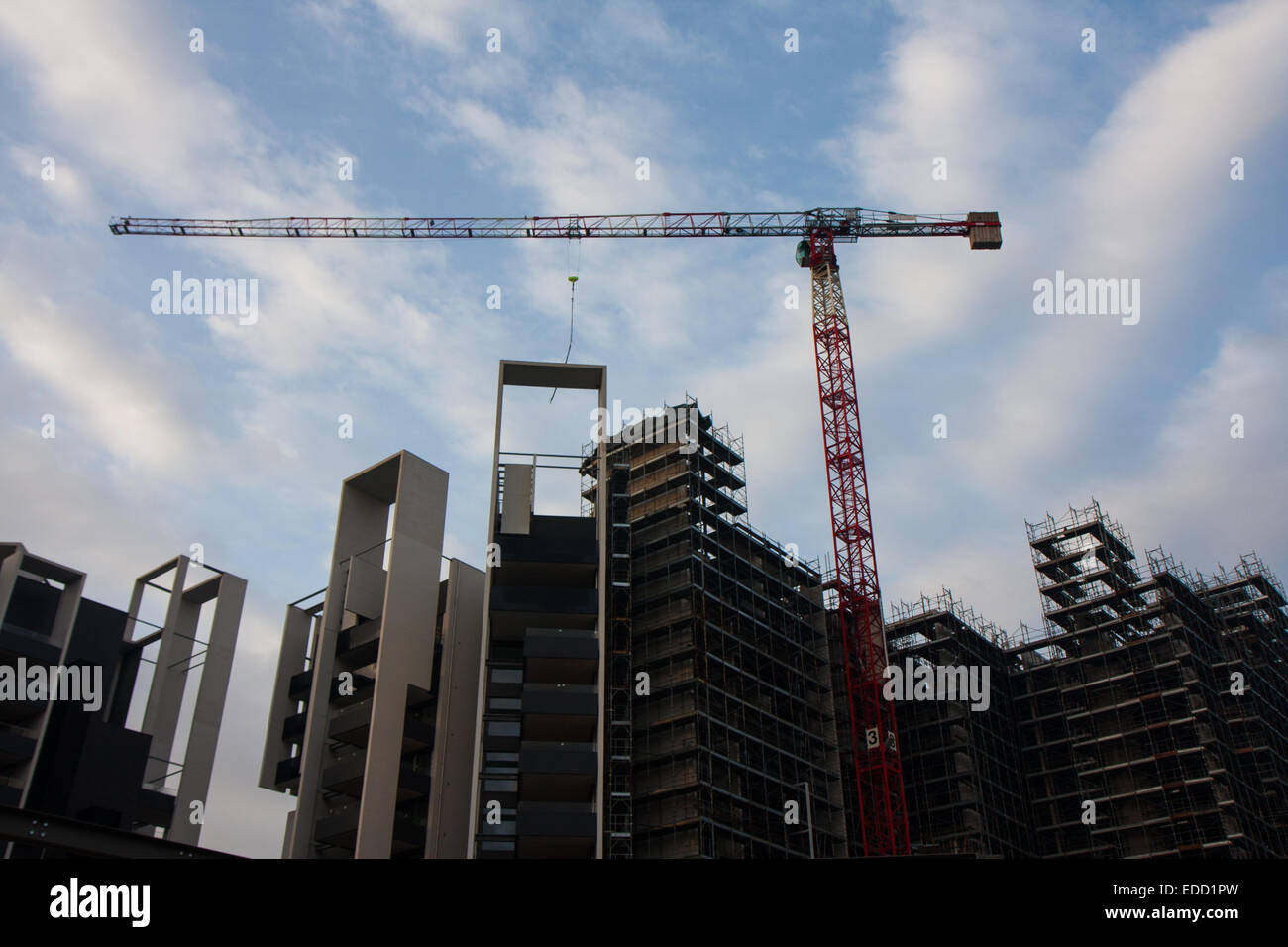 urban landscape with crane and skyscraper Stock Photo - Alamy