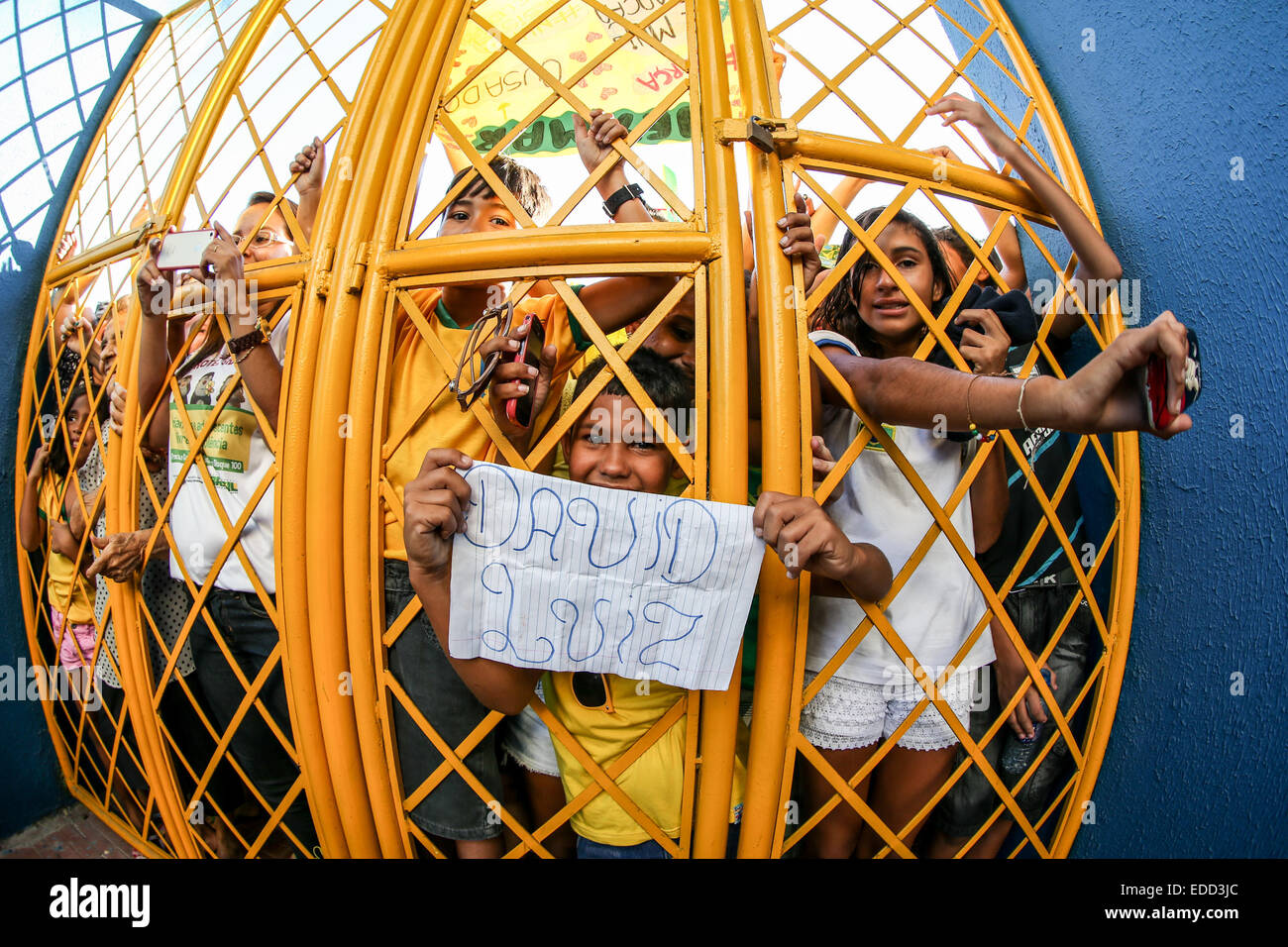 2014 FIFA World Cup - Brazilian football fans crowd outside the gate as ...